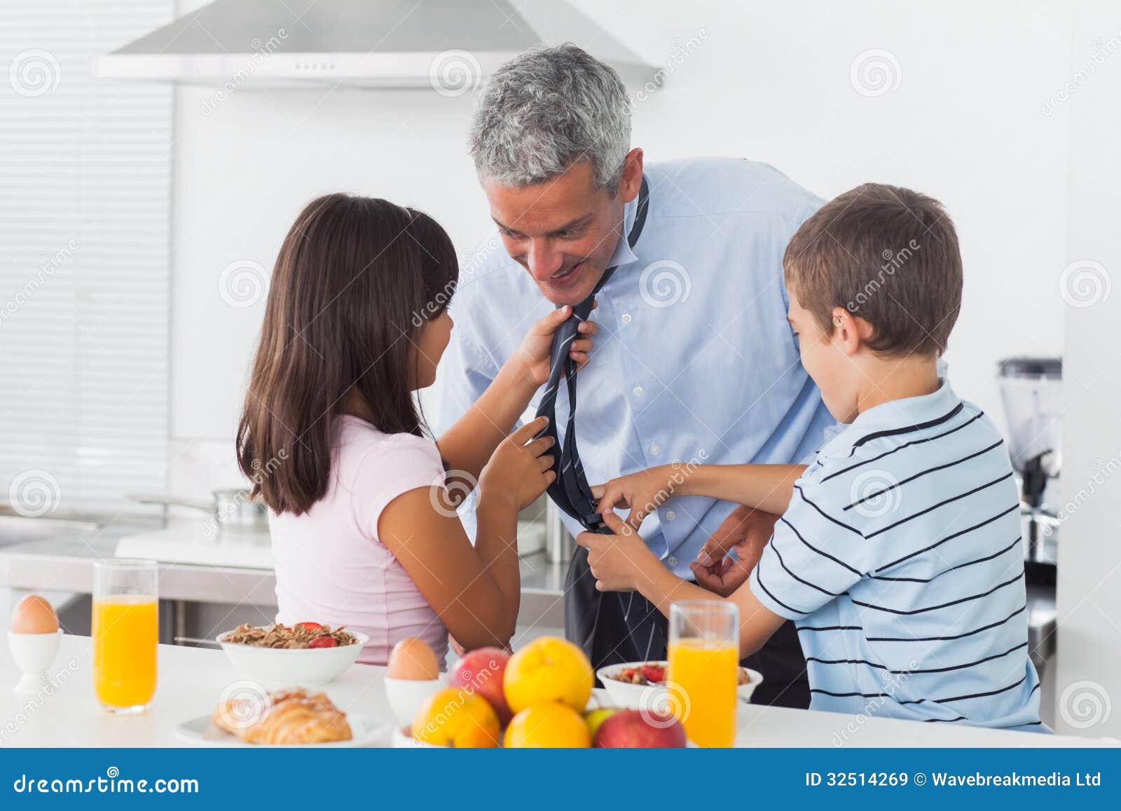 Children Fixing Their Fathers Tie in the Kitchen Stock Image - Image of ...