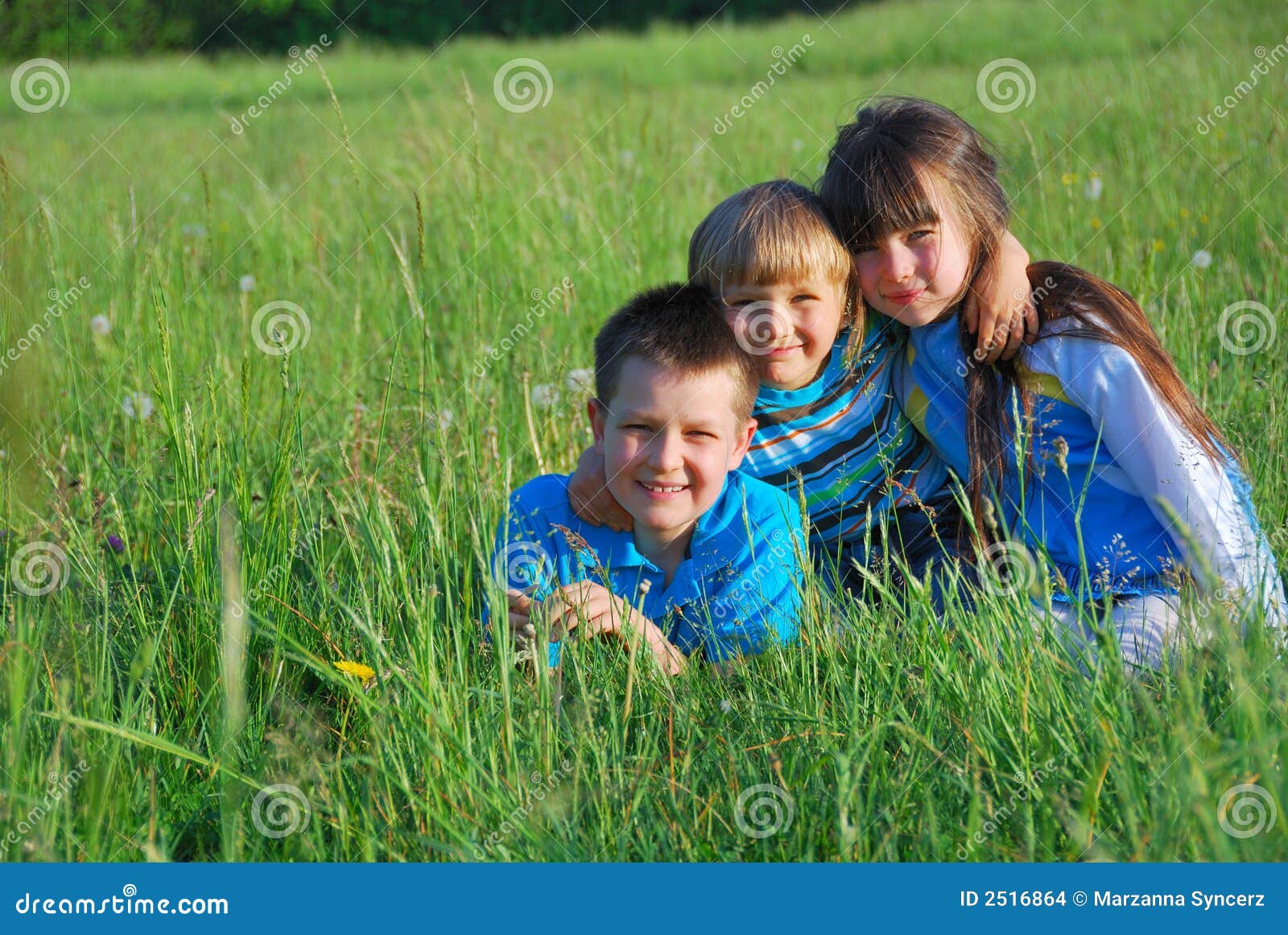 Children in the grass stock photo. Image of relation, grass - 2516864