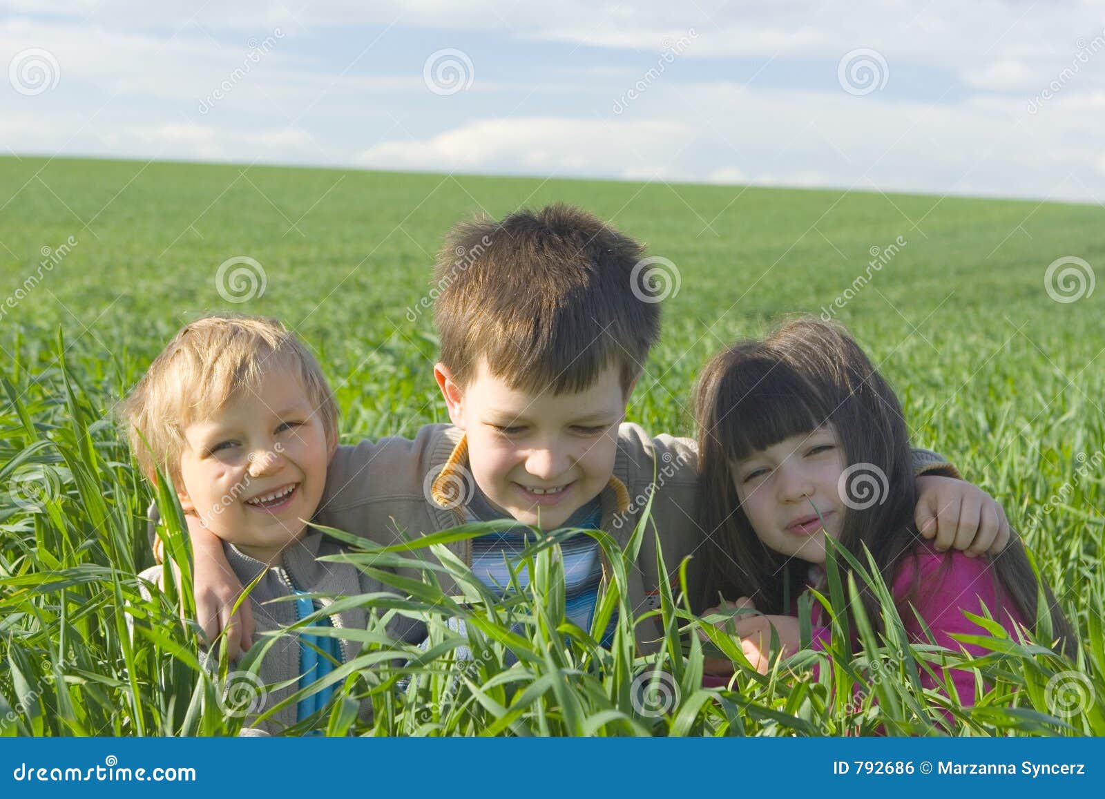 Children in grass stock photo. Image of love, young, together - 792686