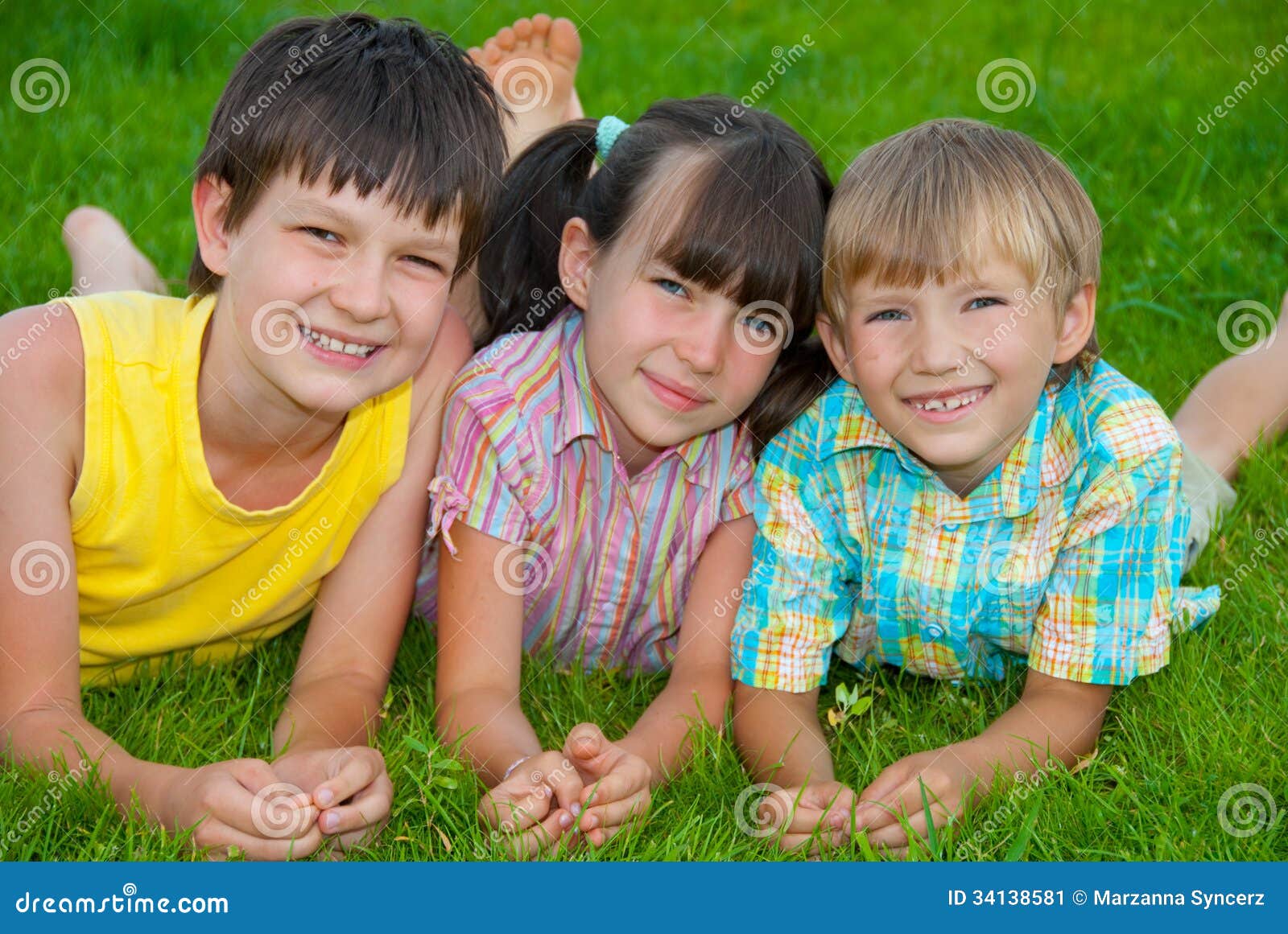 Children on green grass stock image. Image of brothers - 34138581