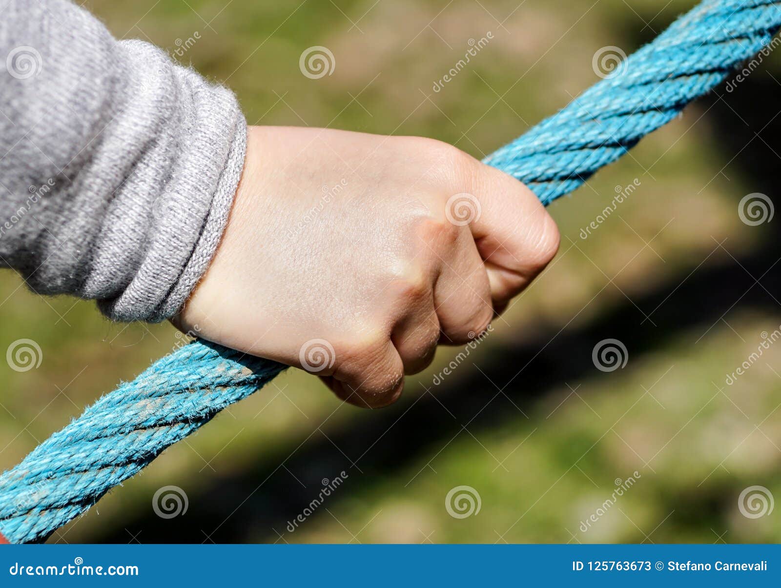 Children Hand Catching the Rope with Sunny Day. Stock Image - Image of ...