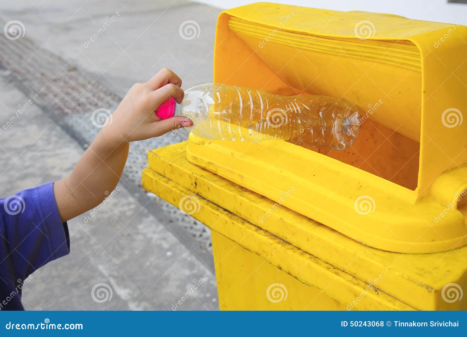 Children Hand Dropping Used Bottle in the Trash Stock Photo - Image of ...