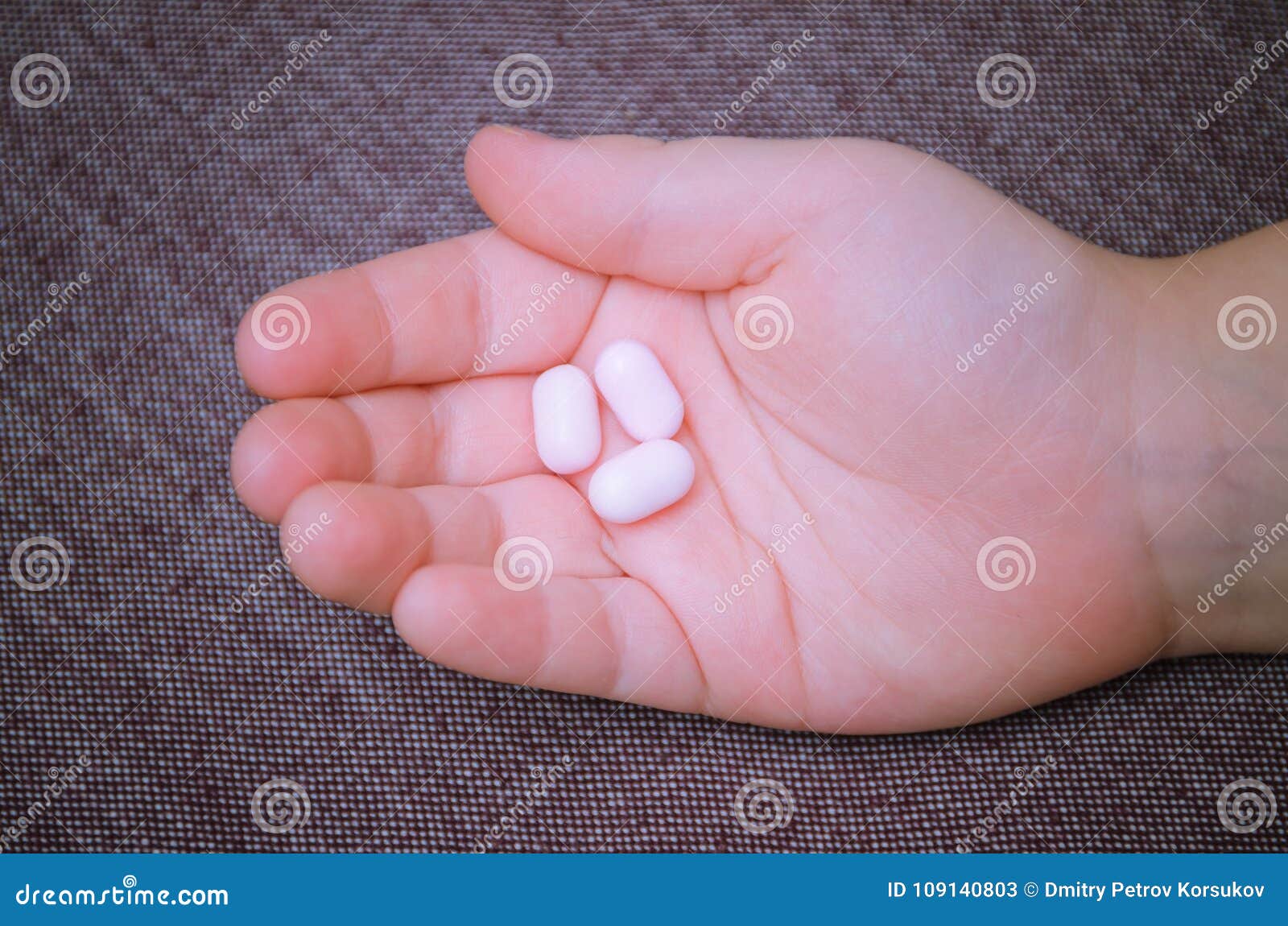 Tablets in a child hand stock image. Image of illness - 109140803