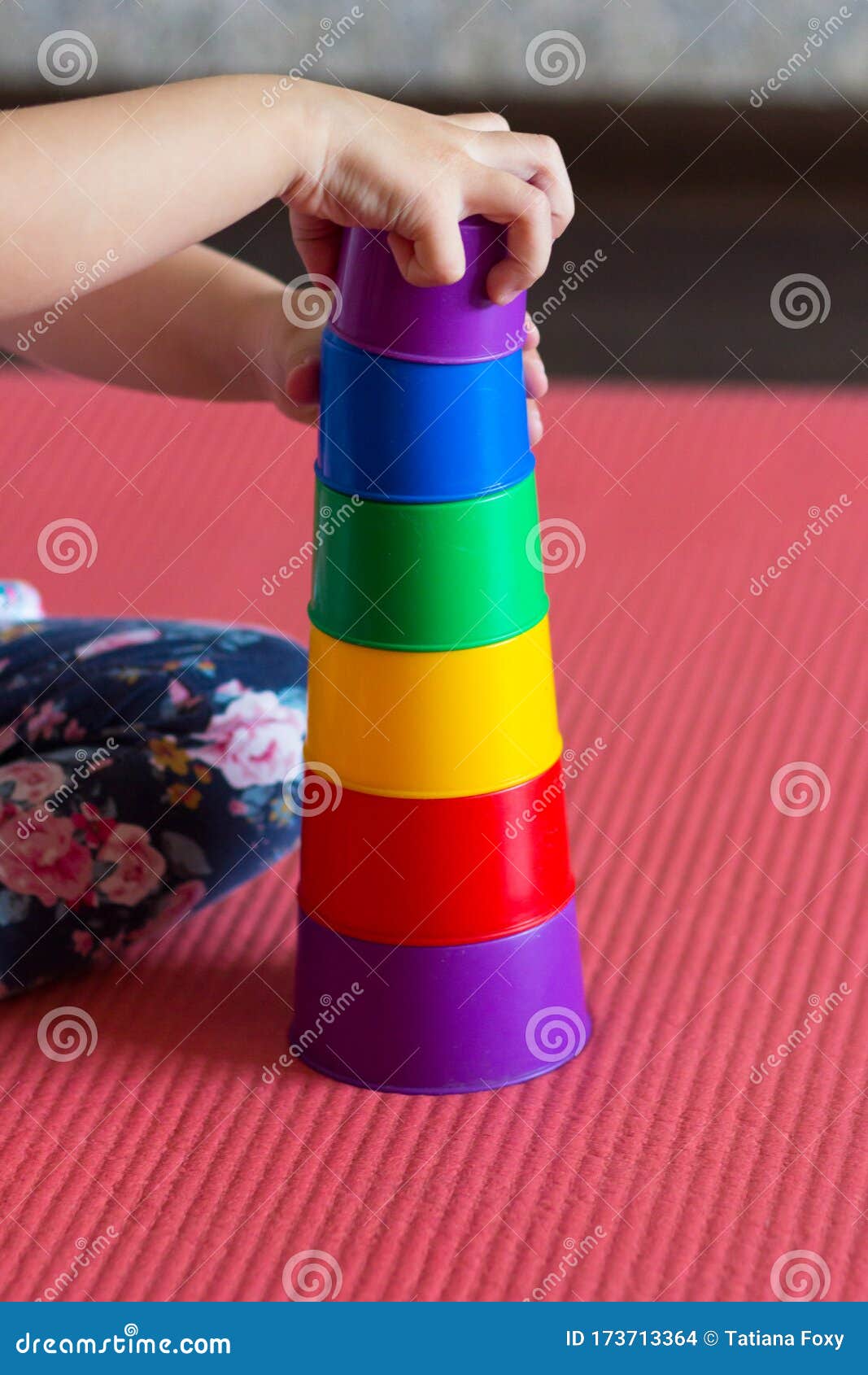 Children Hands Make Pyramid Using Colorful Stacking Cups Stock Photo ...