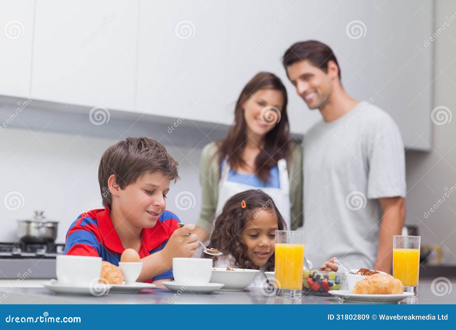 Children Having Breakfast in Kitchen Stock Image - Image of looking ...