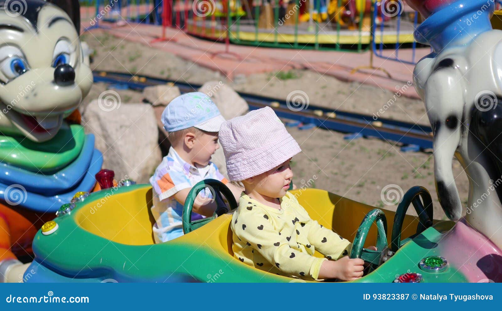Children Having Fun at an Amusement Park.Riding the Car Stock Image ...