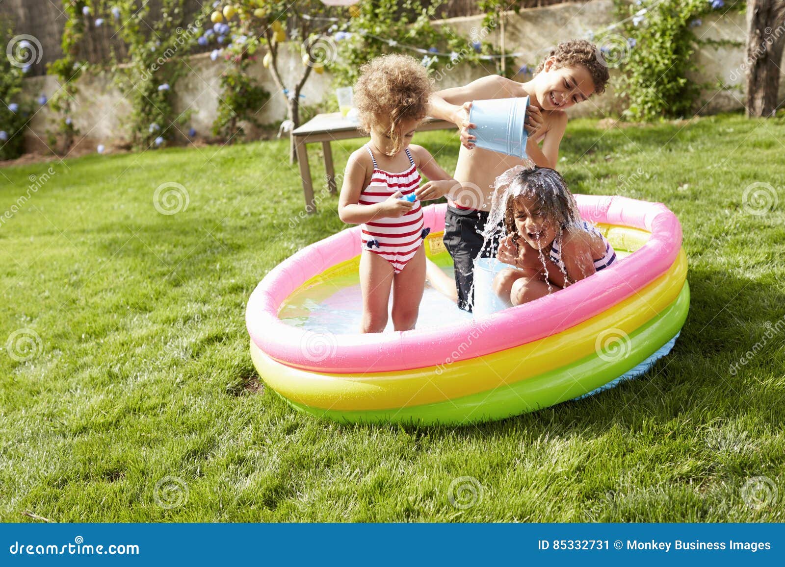 Children Having Fun in Garden Paddling Pool Stock Image - Image of ...