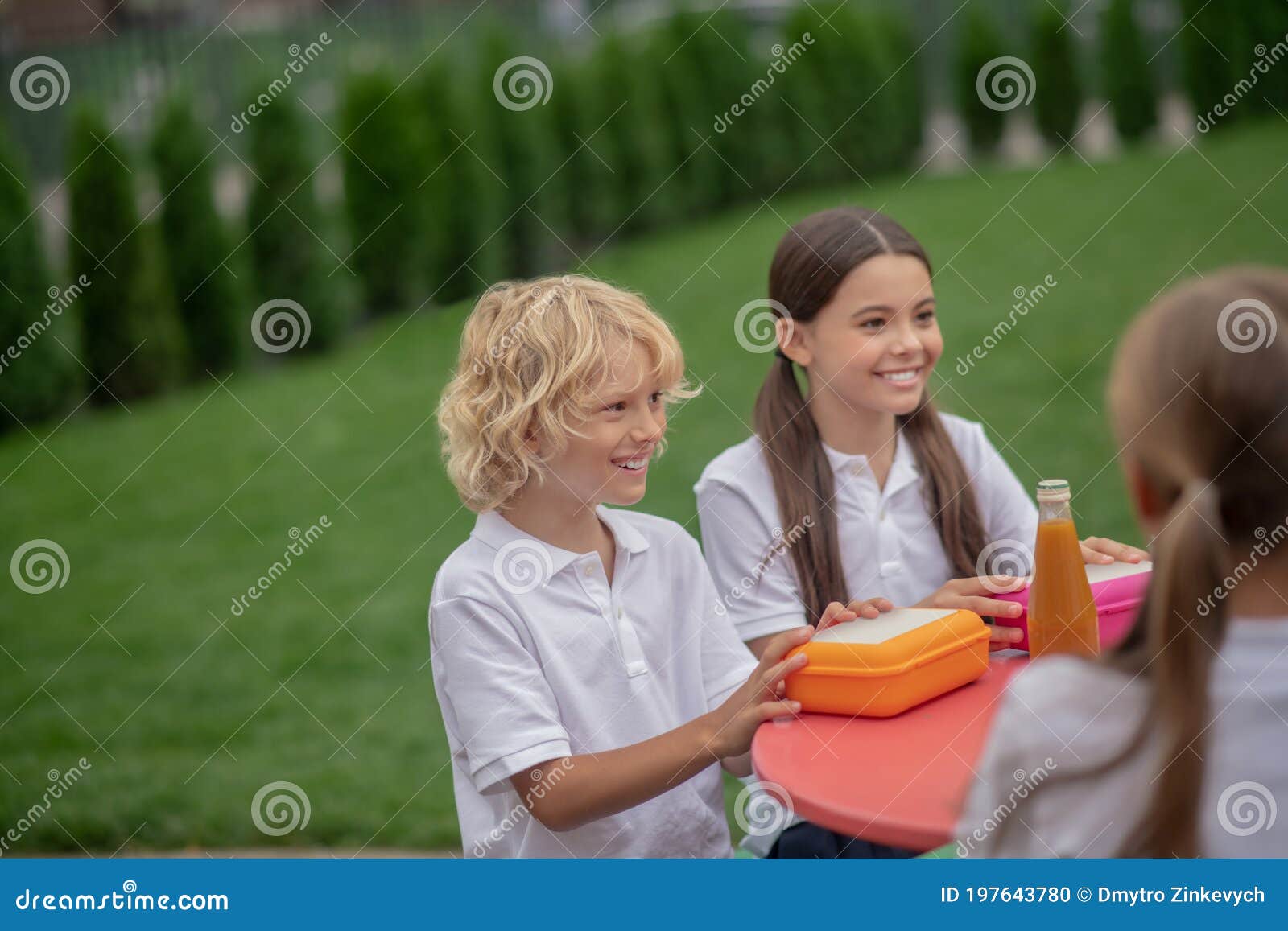 Children Having Lunch Together and Looking Joyful Stock Photo - Image ...