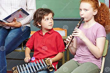 Children Having Music Lessons in School Stock Image - Image of recorder ...