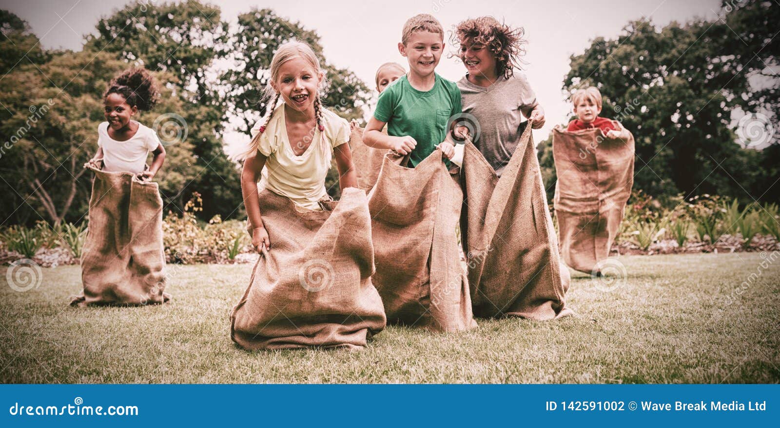 Children Having a Sack Race Stock Photo - Image of caucasian, childhood ...