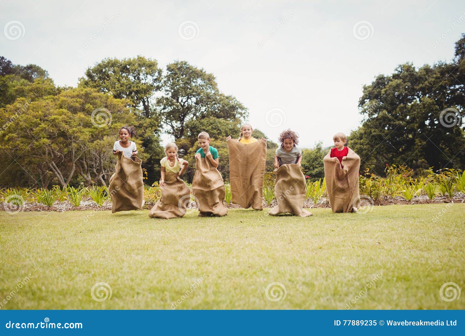 Children Having a Sack Race Stock Image - Image of cheerful, playful ...