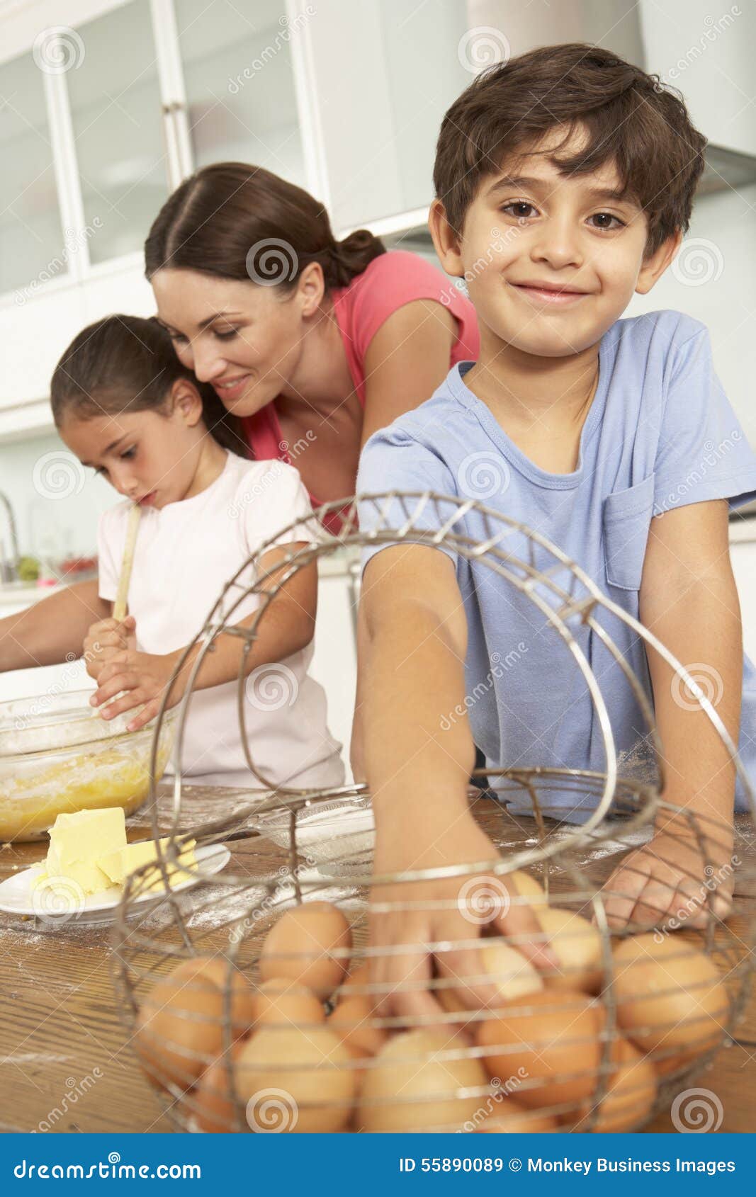 Children Helping Mother To Bake Cakes in Kitchen Stock Image - Image of ...