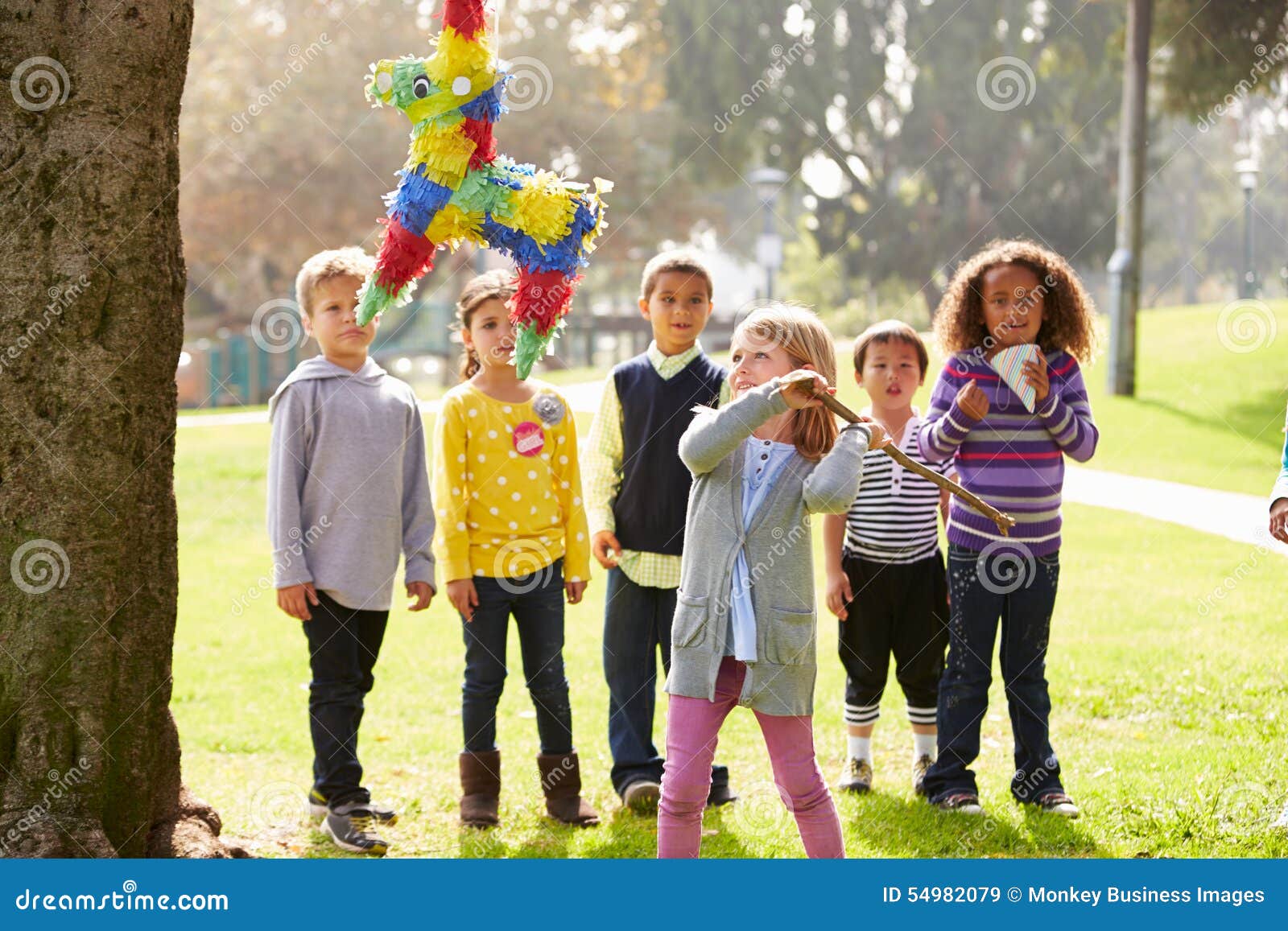 Children Hitting Pinata at Birthday Party Stock Image - Image of asian ...