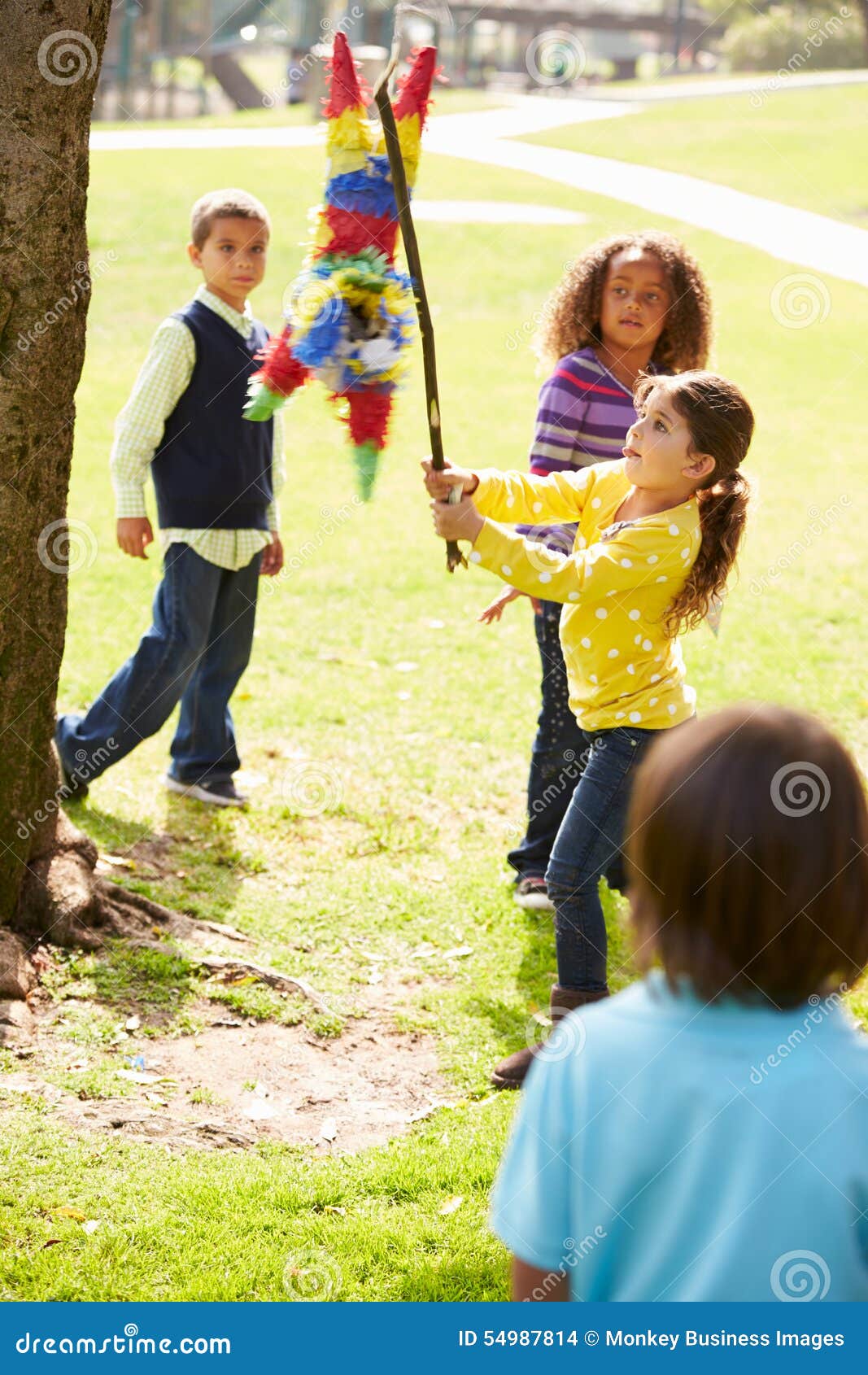 Children Hitting Pinata at Birthday Party Stock Photo - Image of ...