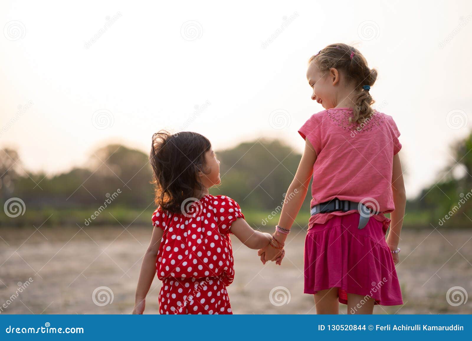 Children Holding Hand while Walking in the Field Stock Photo - Image of ...