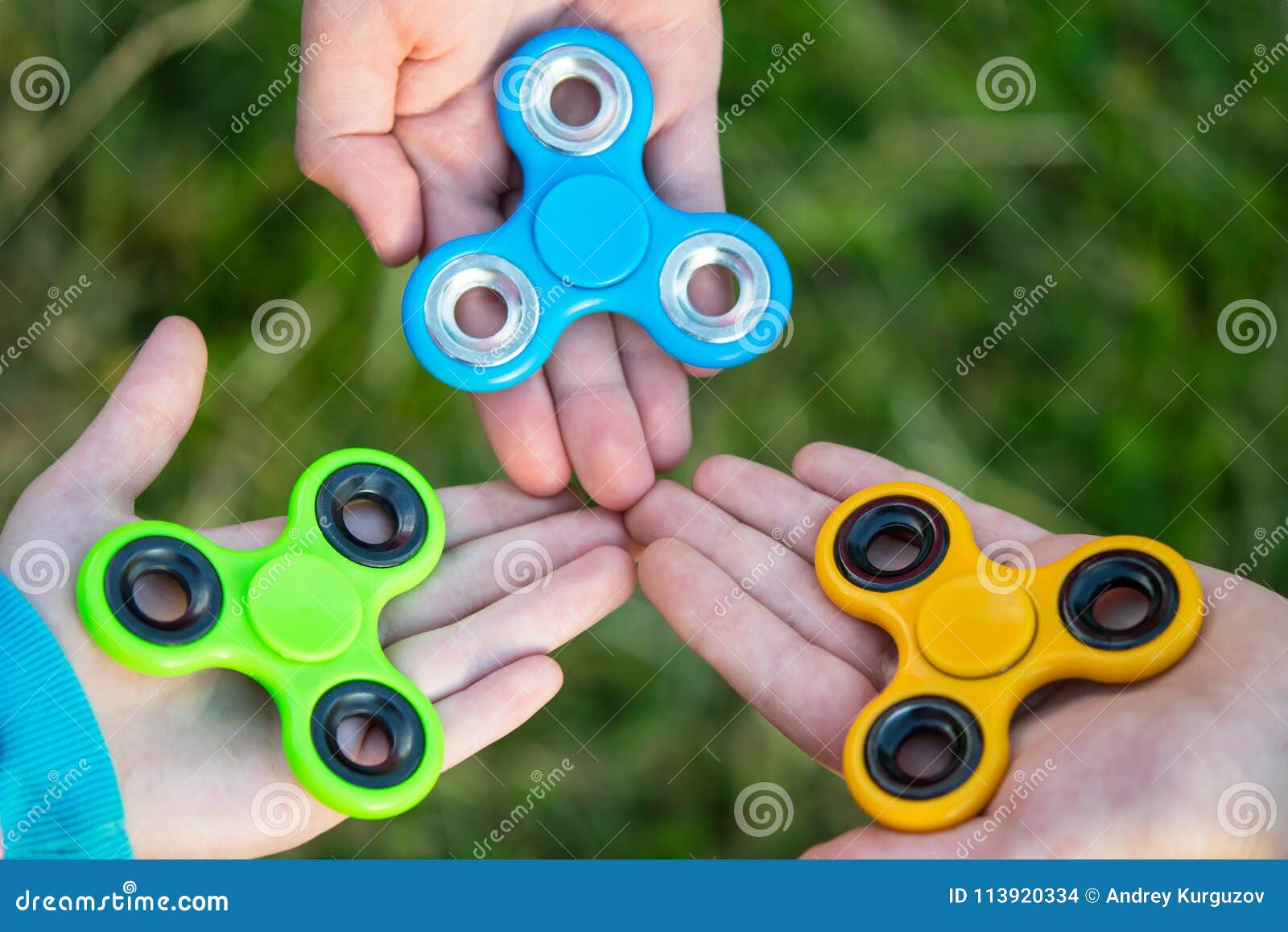 Children are Holding a Spinner and Repeating Its Shape Stock Photo ...