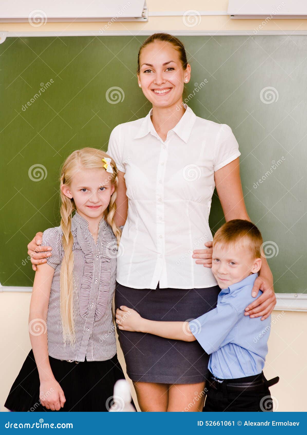 Children Hugging Their Teacher Stock Image - Image of classroom ...