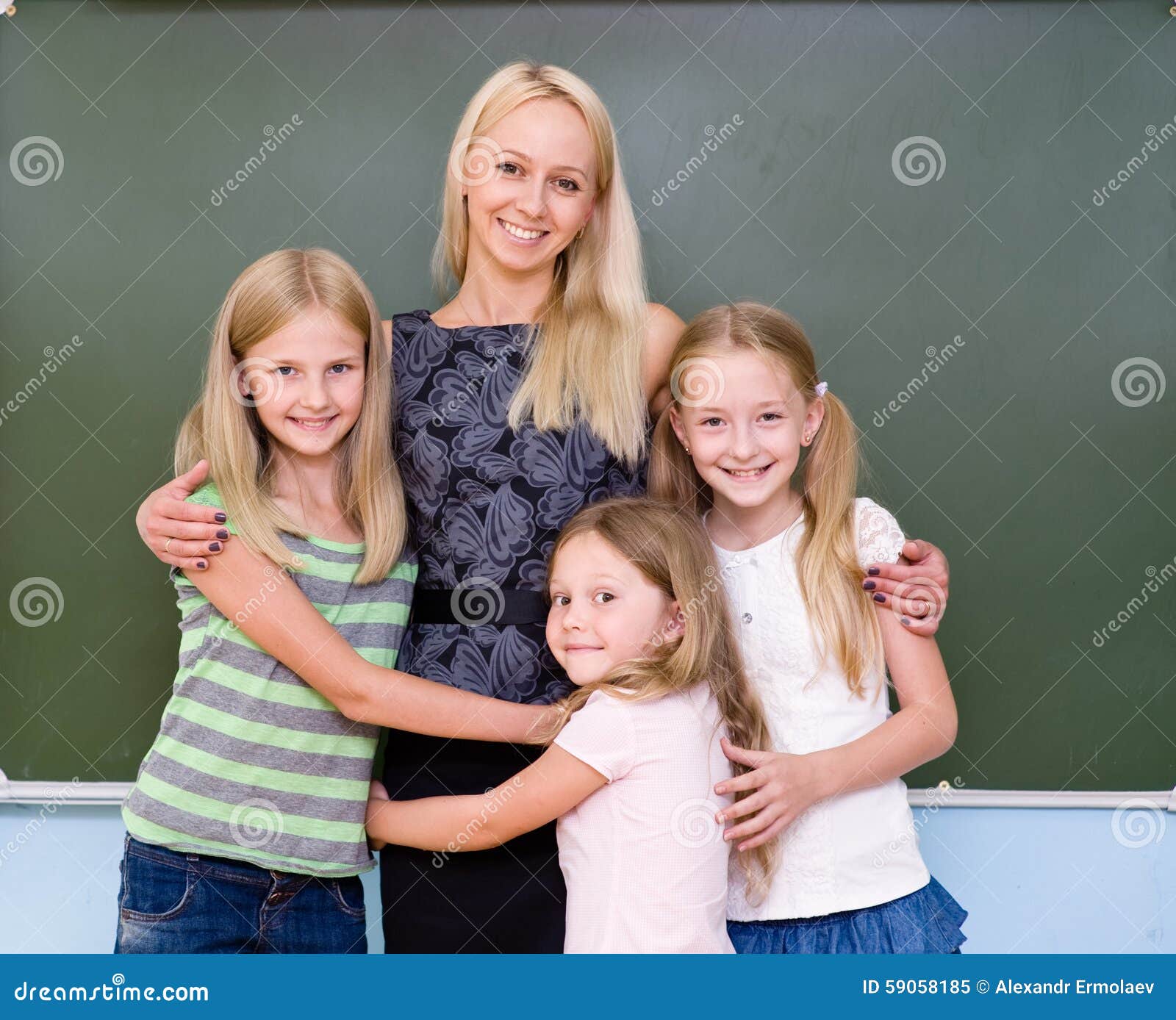 Children Hugging Their Teacher Stock Image - Image of hugging, happy: 59058185