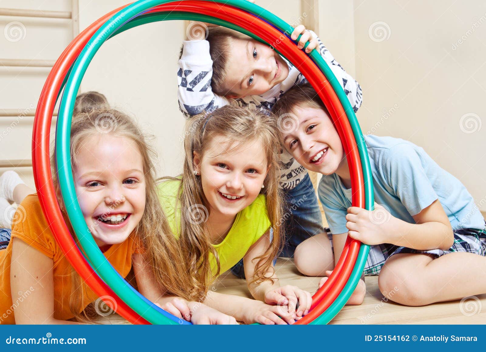 Children with hula hoops stock photo. Image of friends - 25154162