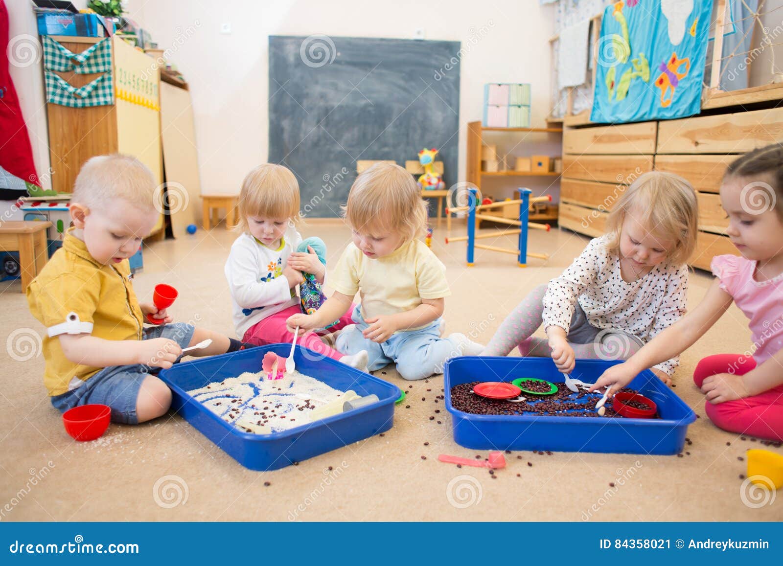 Children Improving Hands Motor Skills With Rice And Beans Stock Image ...