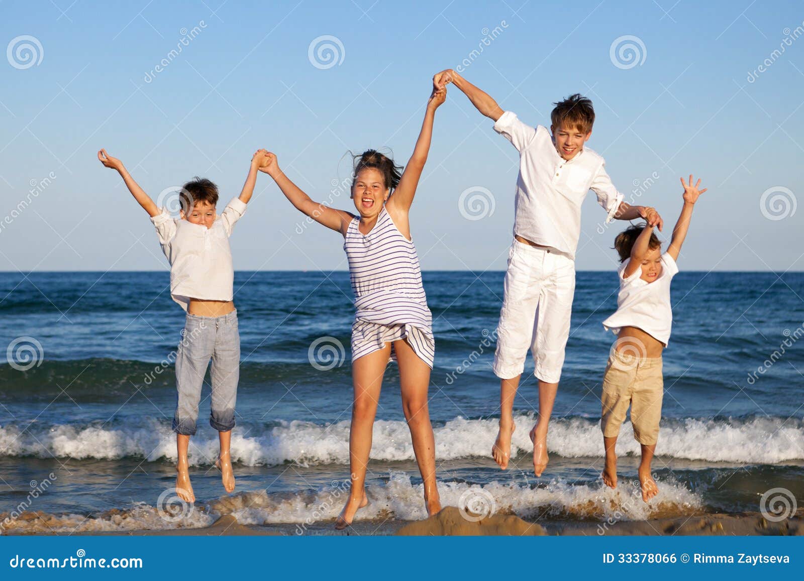 Children are Jumping on Beach Stock Photo - Image of summer, shore ...