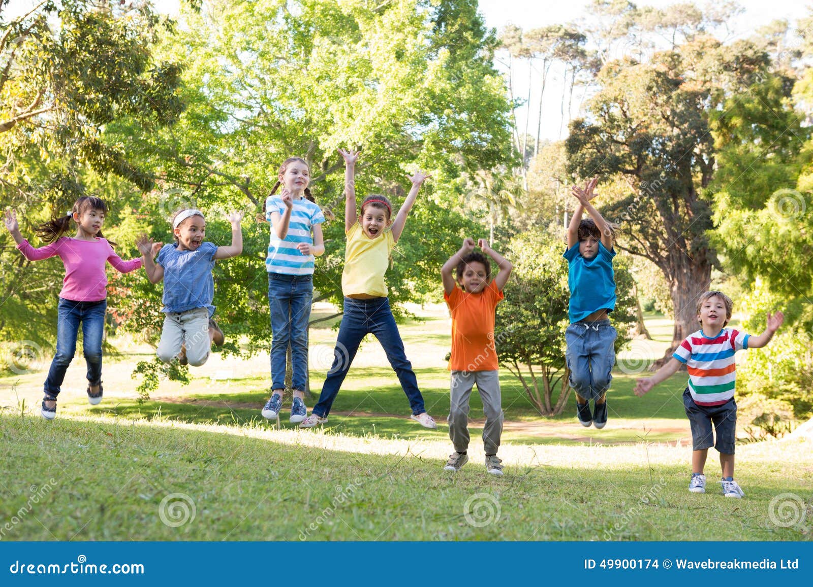 Children Jumping in the Park Stock Photo - Image of female, girl: 49900174