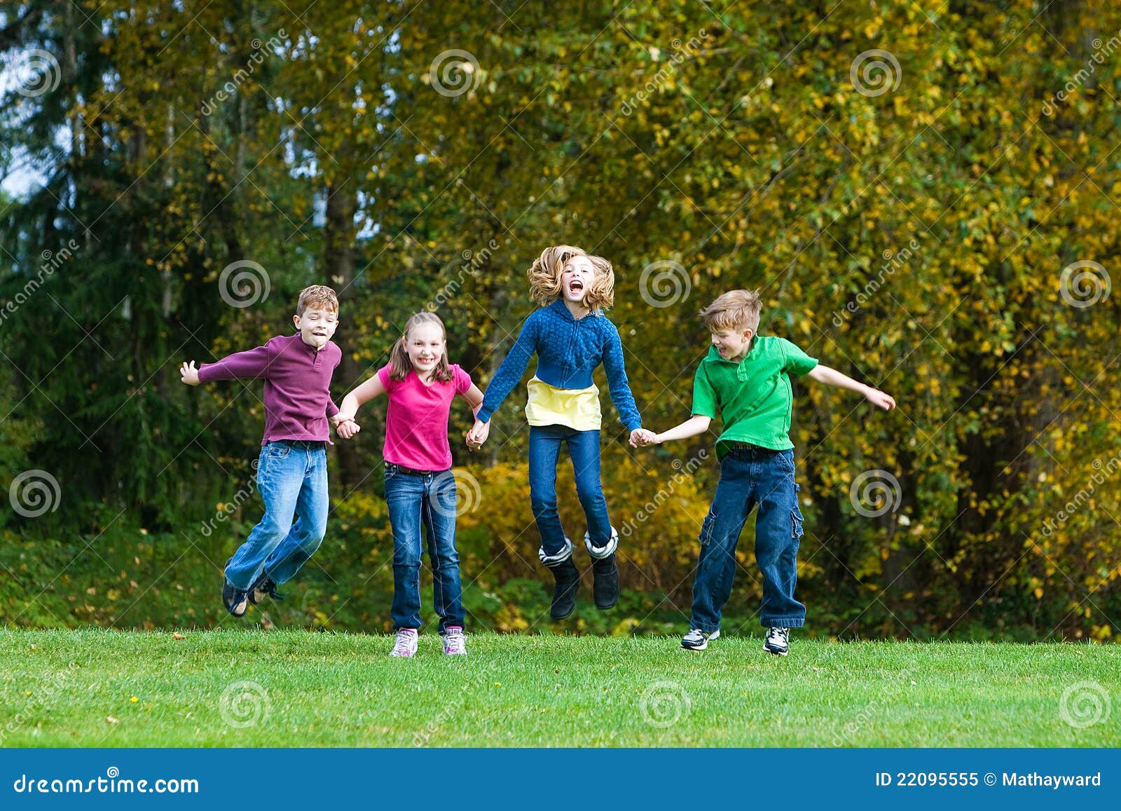 Children jumping together stock image. Image of field - 22095555