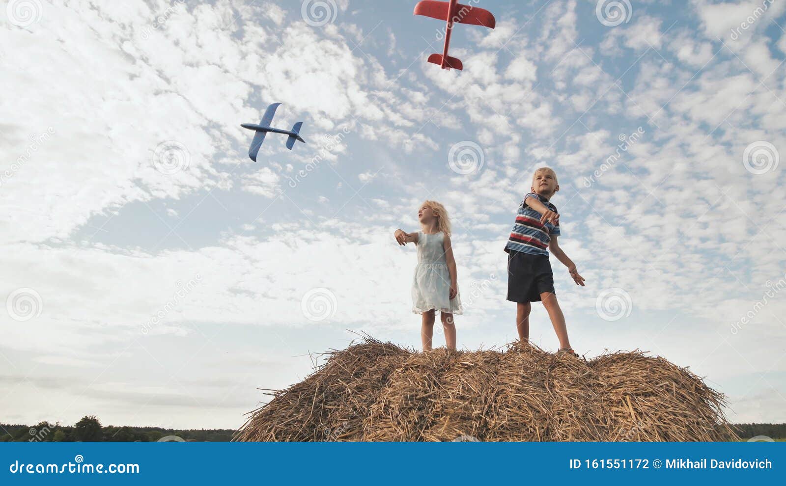 Children Launch Airplanes Standing on a Stack of Straw. Stock Footage ...