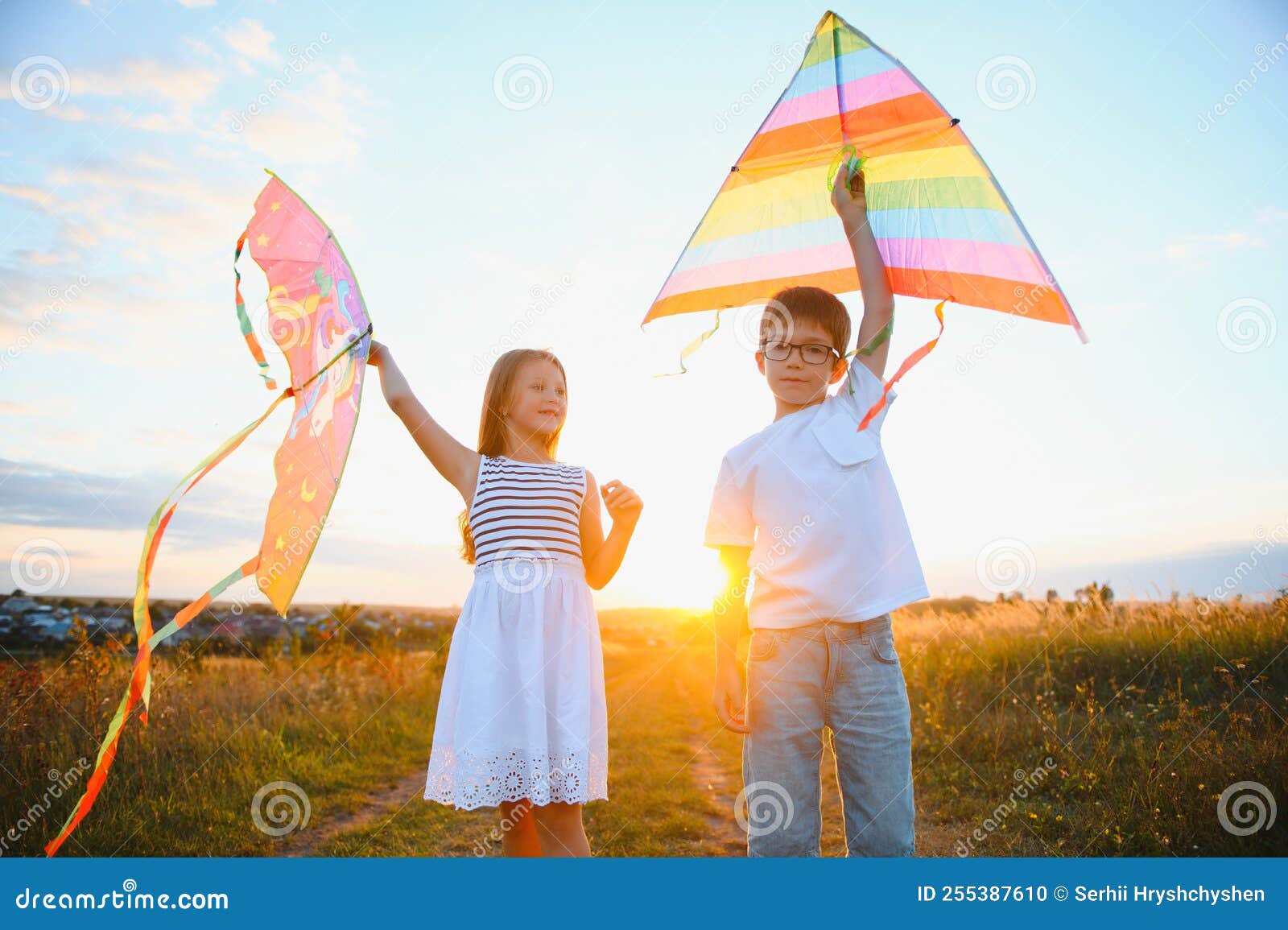 Children Launch a Kite in the Field at Sunset Stock Photo - Image of ...