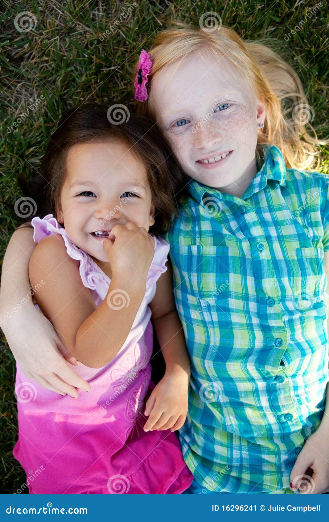 Children Laying in the Grass Outside Stock Image - Image of teach ...