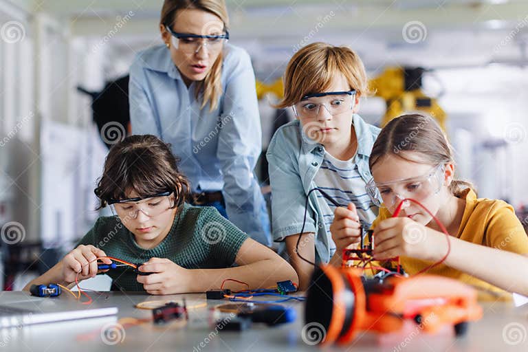 Children Learning Robotics in Elementary School. Young Students ...