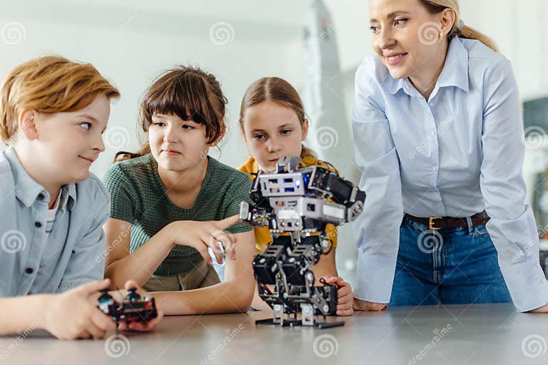 Children Learning Robotics in Elementary School. Young Students ...