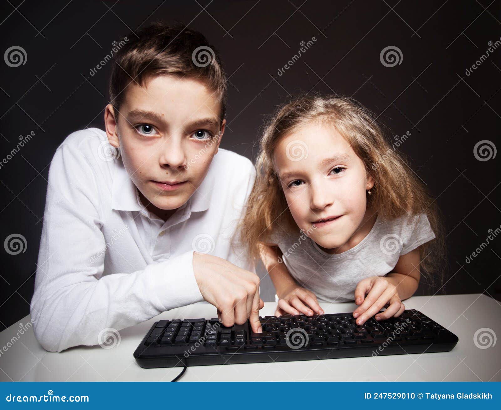 Children Looking at a Computer Stock Photo - Image of girls, technology ...