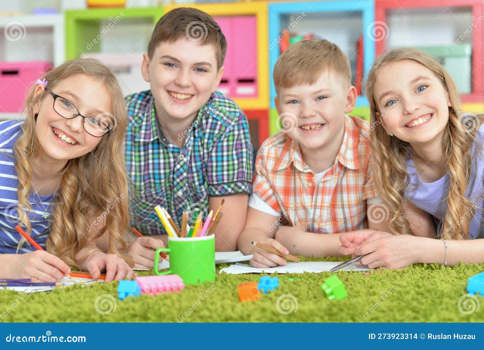 Children Lying on Floor Drawing with Pencils Stock Photo - Image of ...