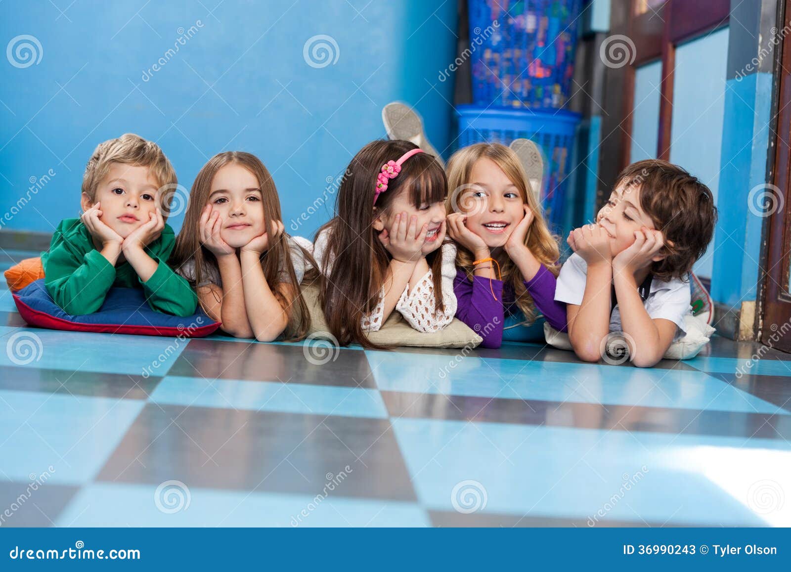 Children Lying in a Row on Floor Stock Image - Image of beautiful ...