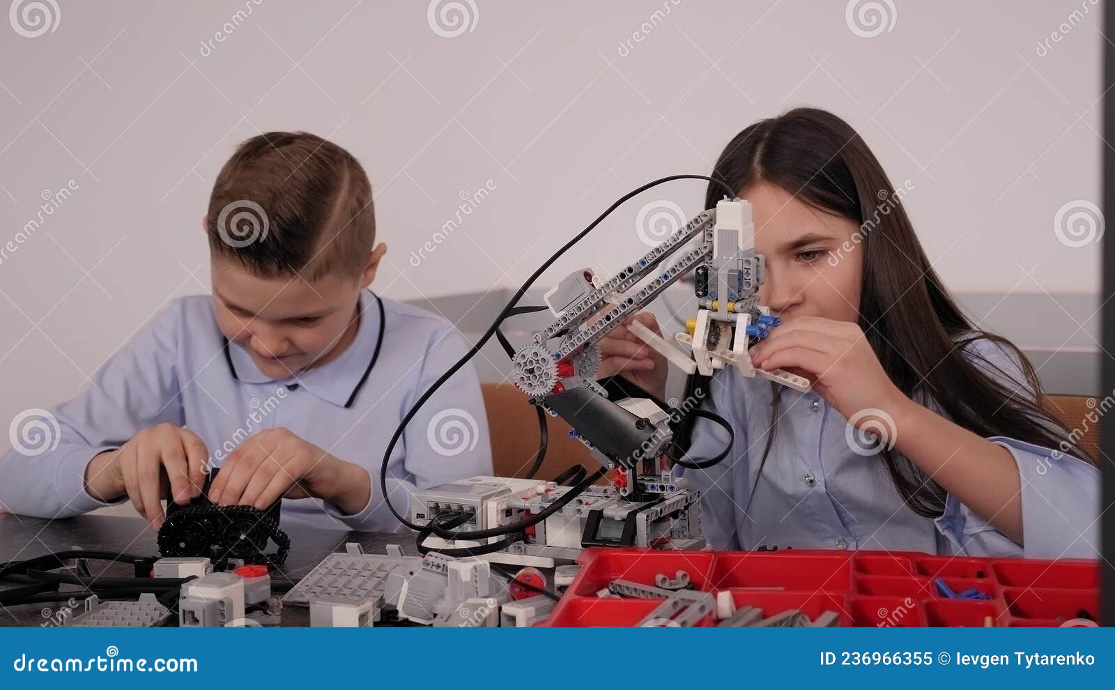Children Makes a Robot from the Robotic Constructor at the Desk with ...