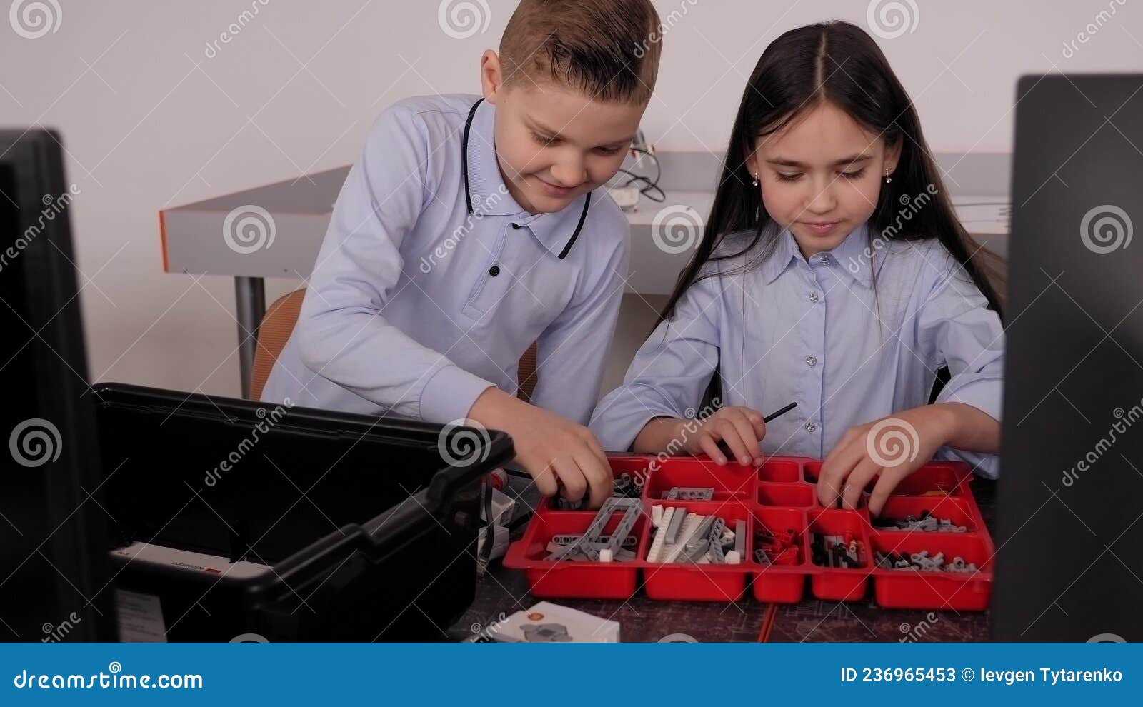 Children Makes a Robot from the Robotic Constructor at the Desk with ...