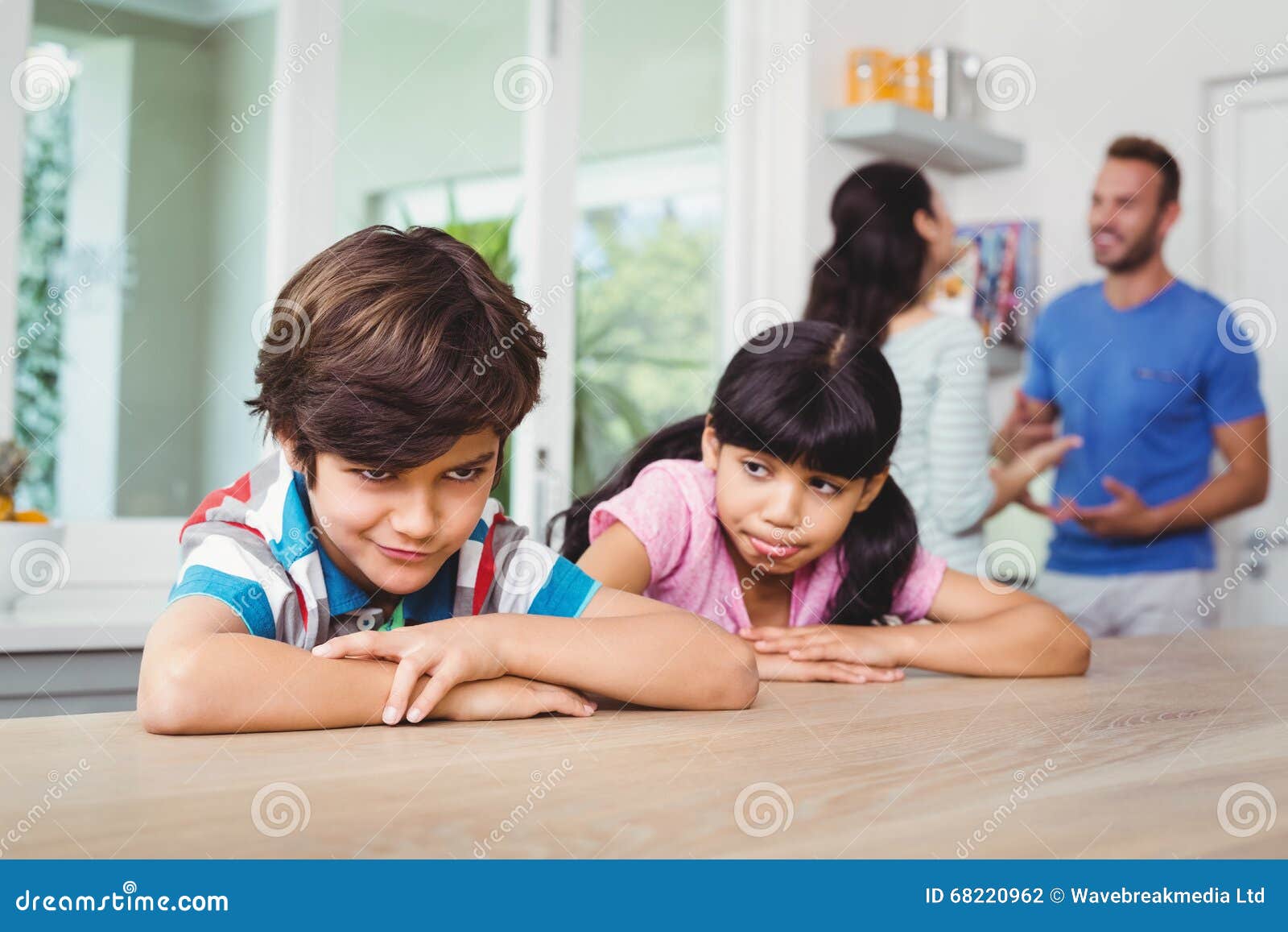 Children Making Faces while Sitting at Table Stock Photo - Image of ...