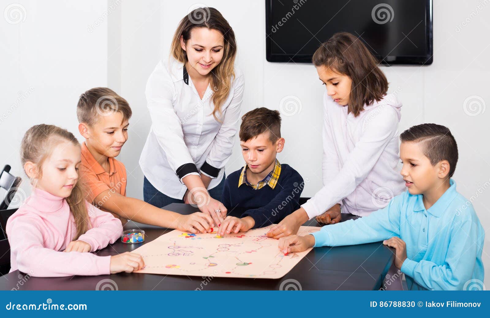 Children Making Move on Pre-marked Surface of Board Game Stock Photo ...