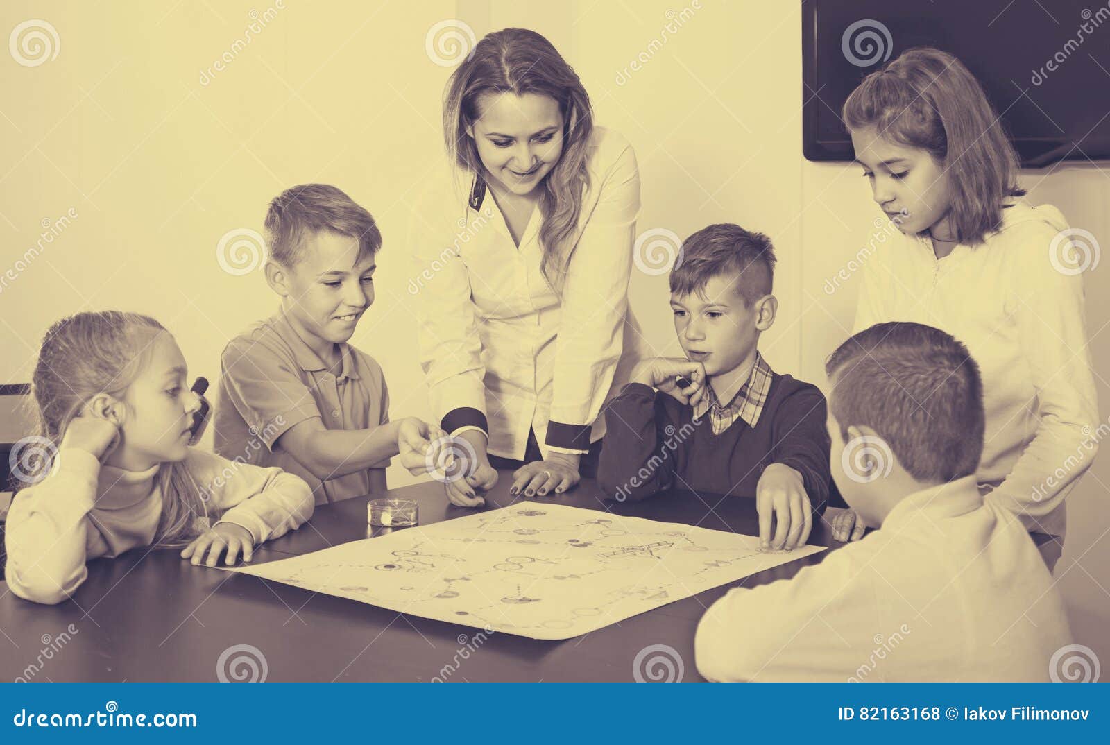 Children Making Move on Pre-marked Surface of Board Game Stock Photo ...