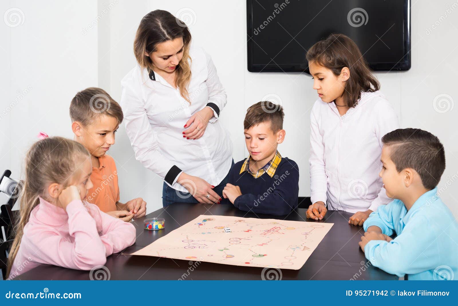 Children Making Move on Pre-marked Surface of Board Game Stock Photo ...
