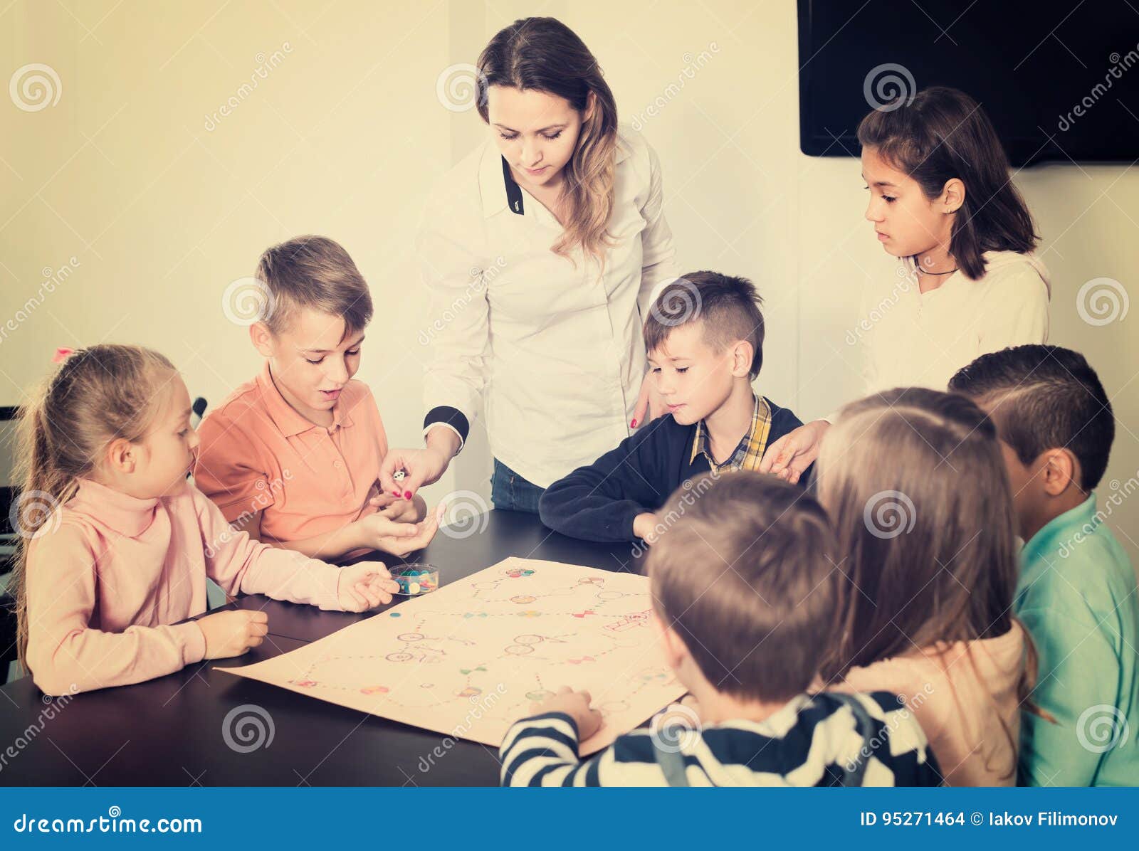 Children Making Move on Pre-marked Surface of Board Game Stock Photo ...