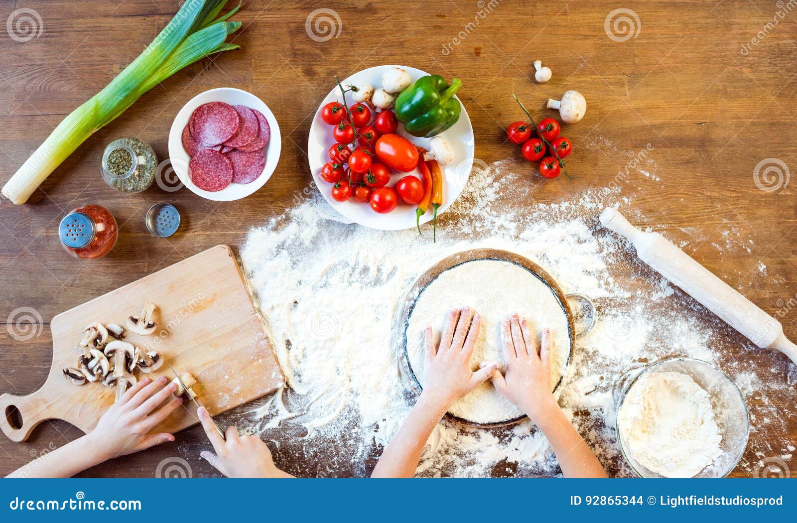 Children Making Pizza Dough and Preparing Pizza Ingredients in Kitchen ...