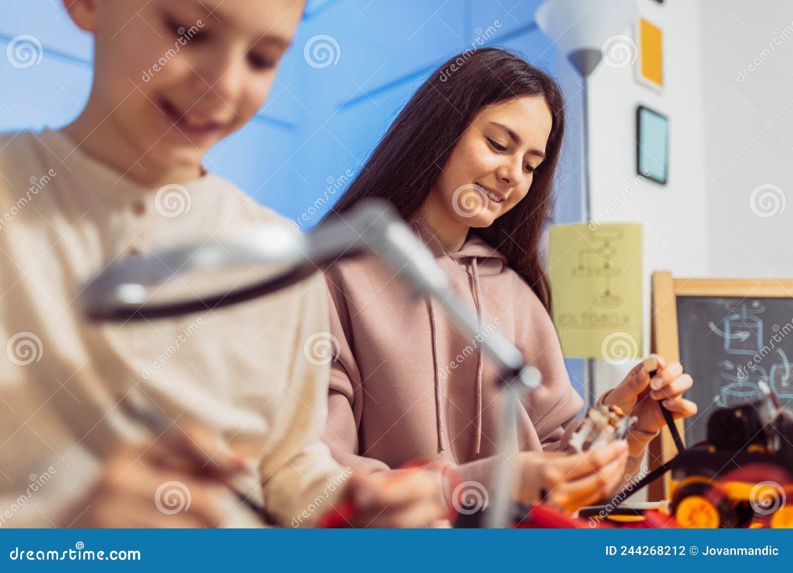 Children Making a Robot at Home. Stock Photo - Image of family ...