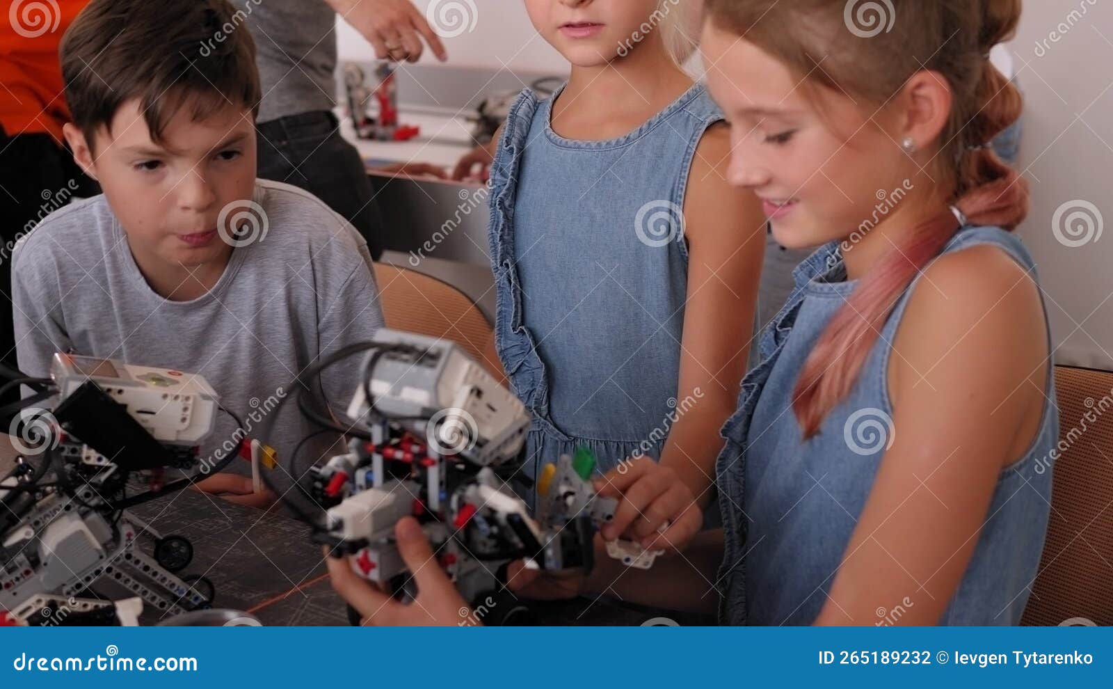 Children are Making Robots from the Constructor at the Desk with ...