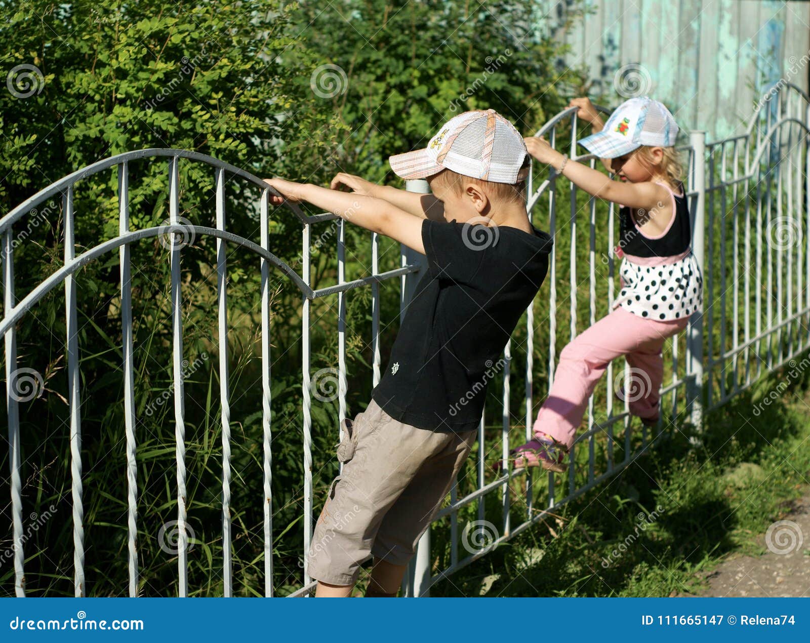 Children on fence stock image. Image of metal, friends - 111665147