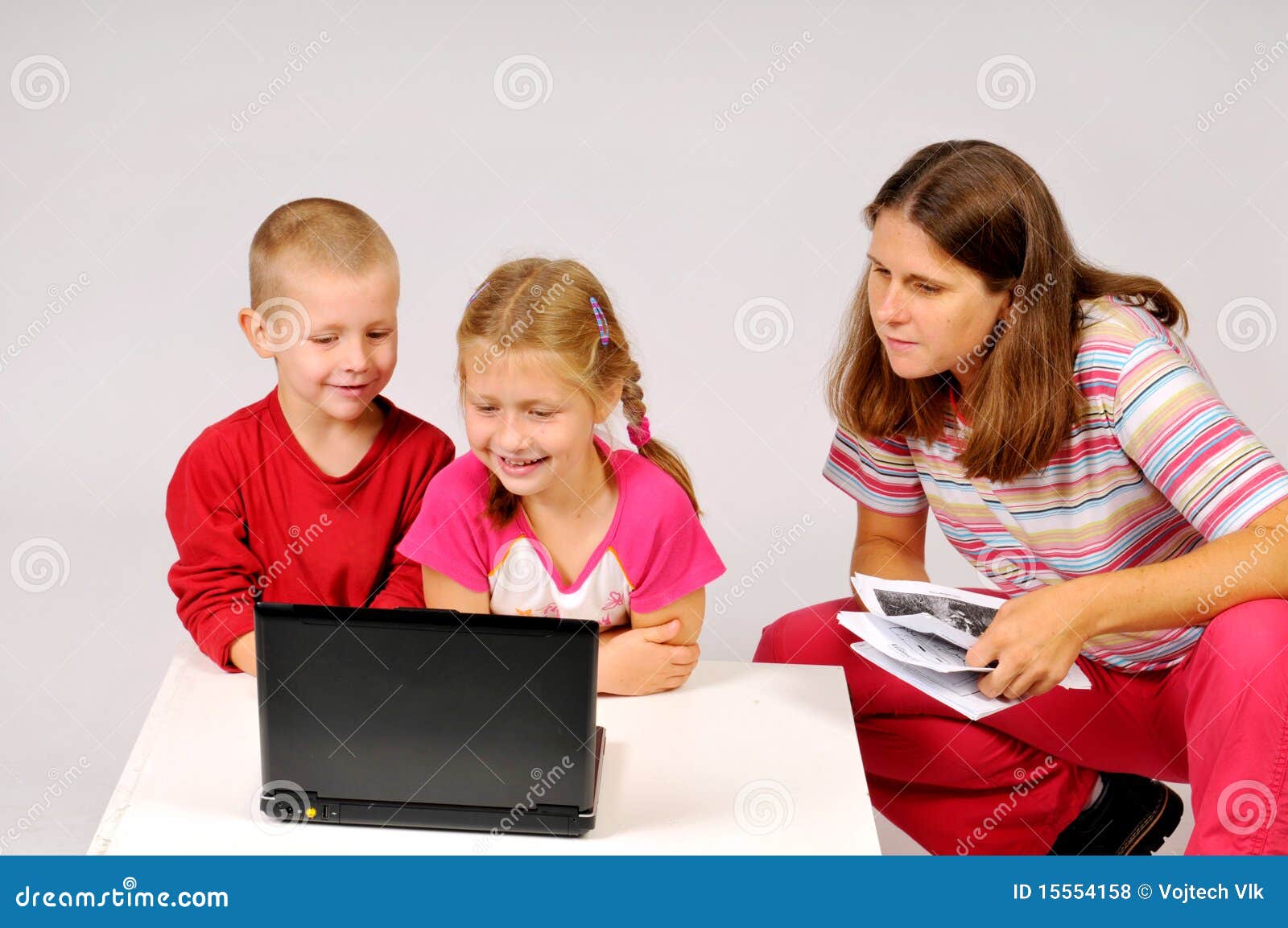 The children and notebook stock photo. Image of mother - 15554158