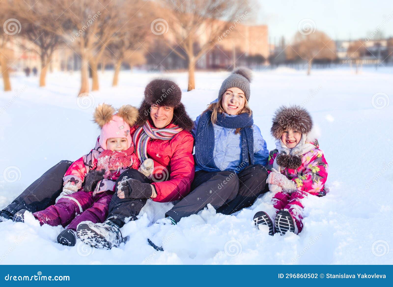 Children with Parents Sitting on Snow in Winter Stock Photo - Image of ...