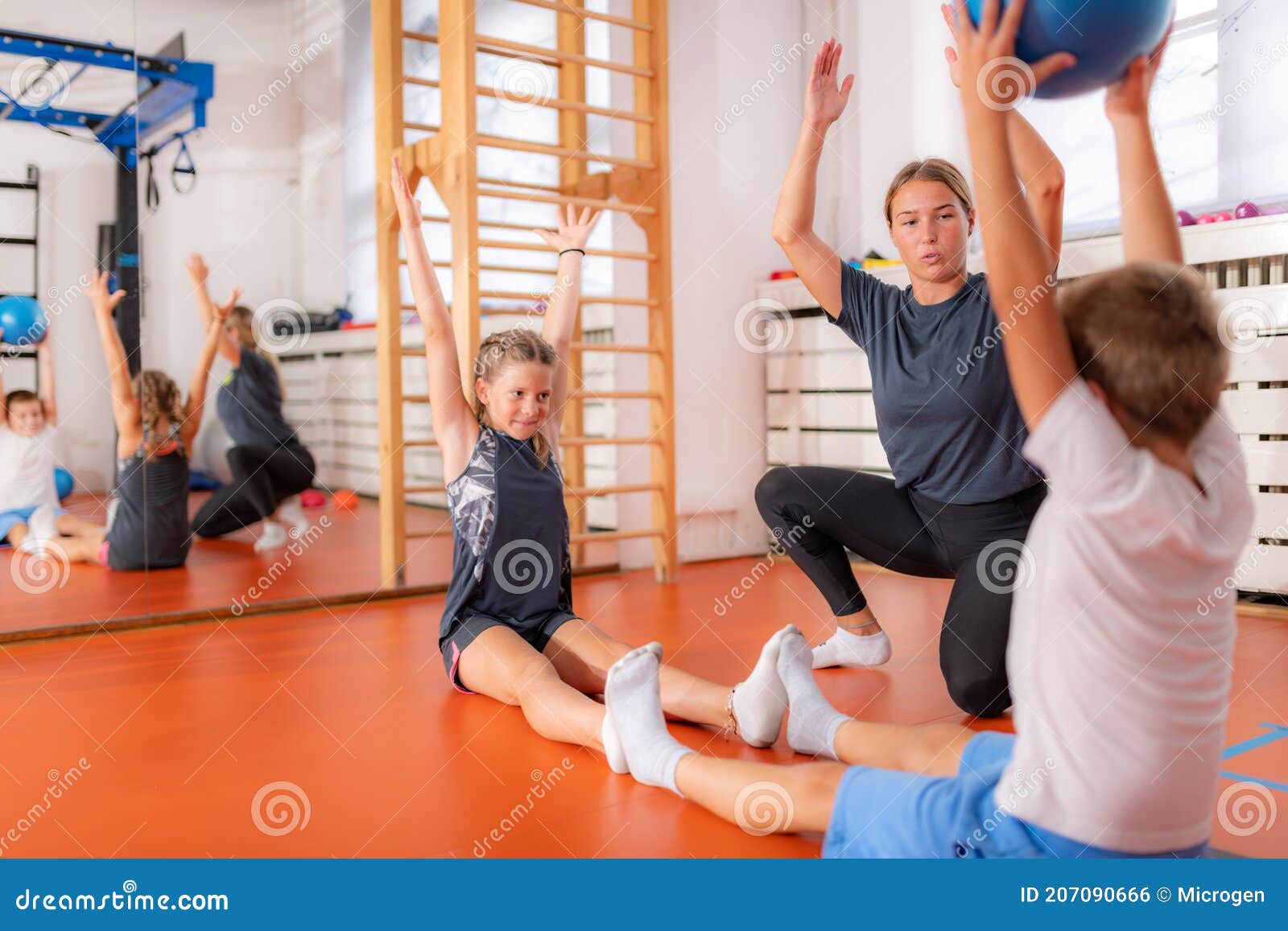 Children in a Physical Activity Class, Exercising with Fitness Balls ...