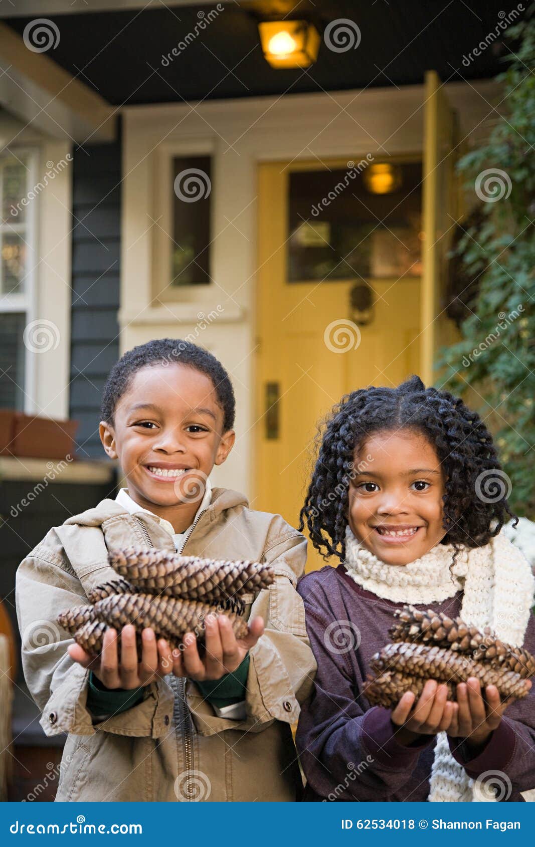 Children with pine cones stock photo. Image of male, child - 62534018
